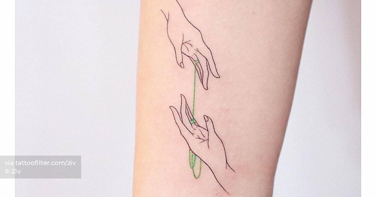 Fine line hands tattoo on the wrist