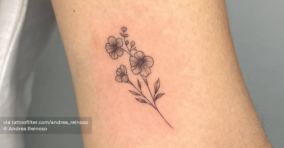 Flowers tattoo located on the inner arm, illustrative
