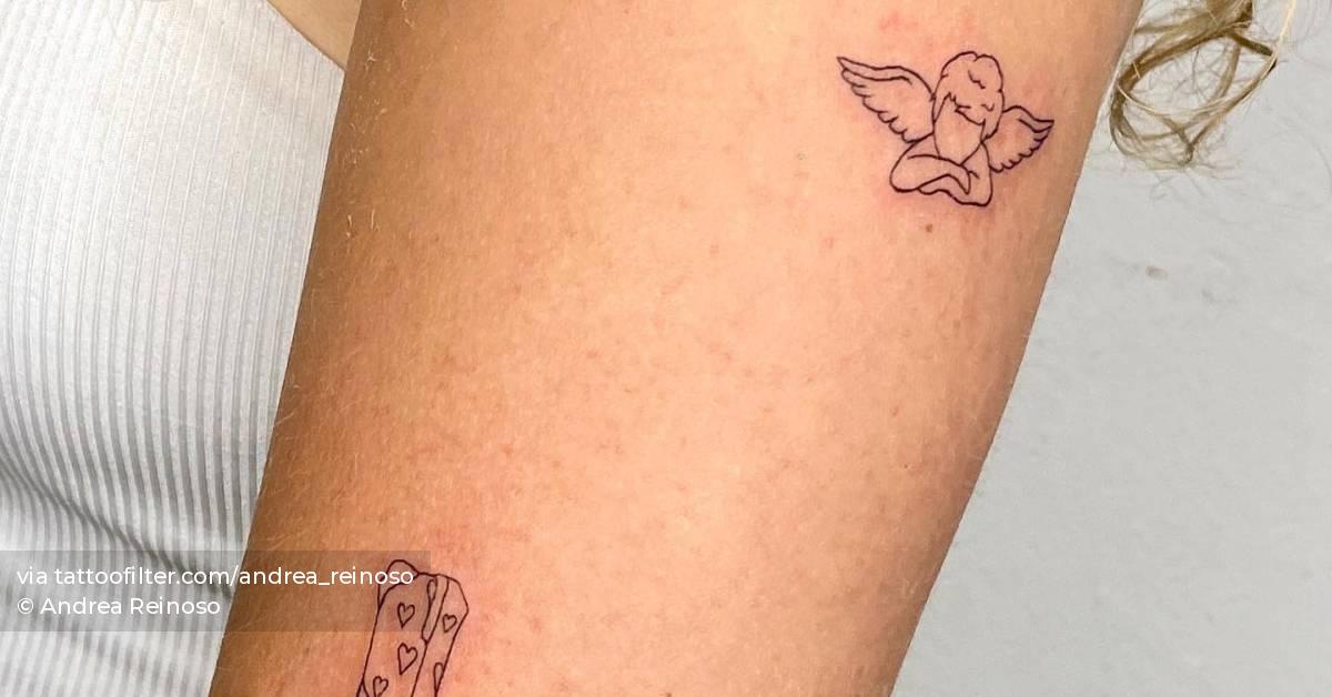 Fine line coboy boot and cherub tattoo located on the