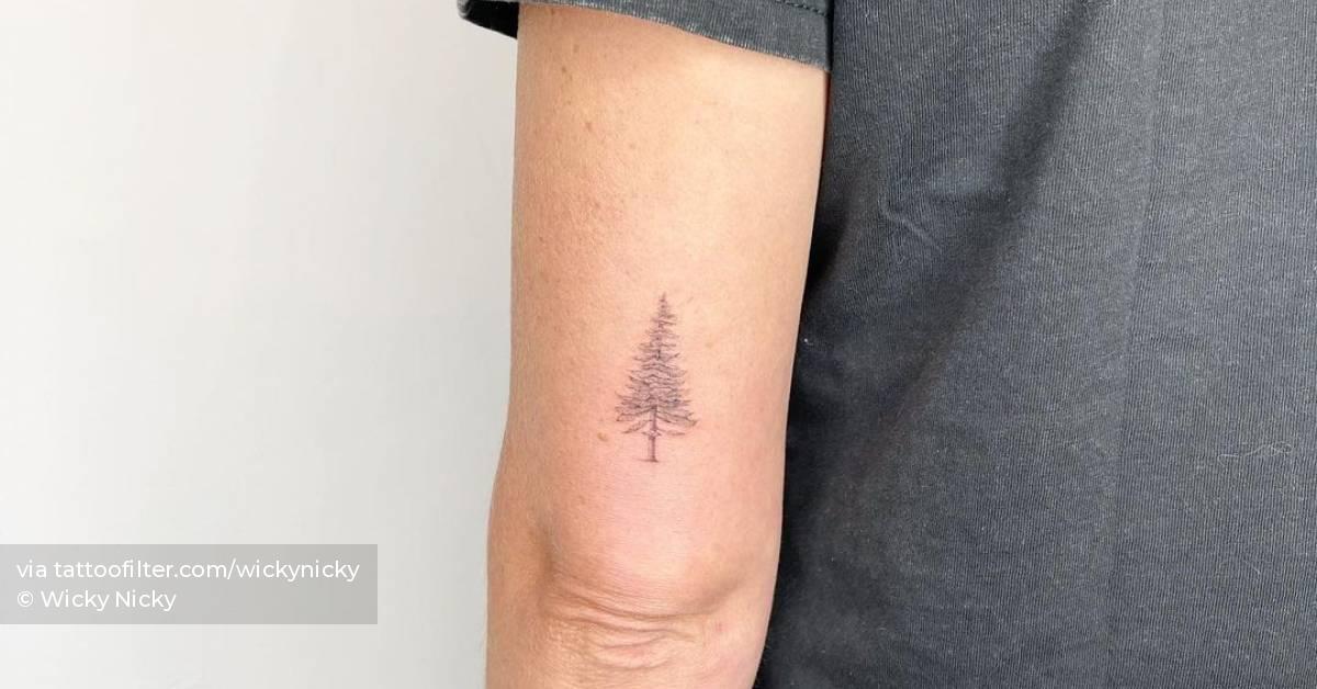 Micro-realistic style pine tree tattoo located on the