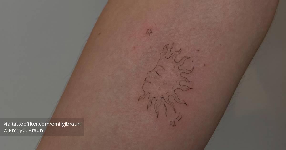 FIne line style sun tattoo located on the inner