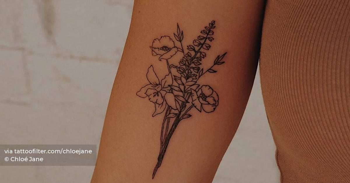 Flower bouquet tattoo placed on the inner arm, done in