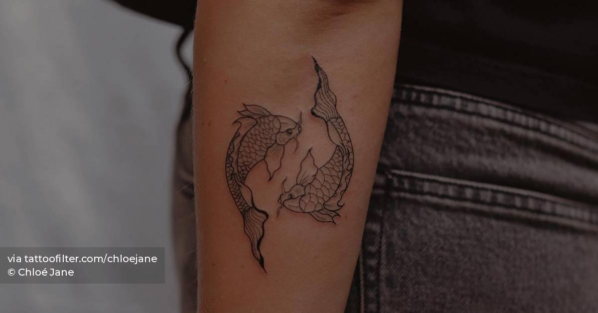 Fine line style koi fish tattoo located on the forearm.