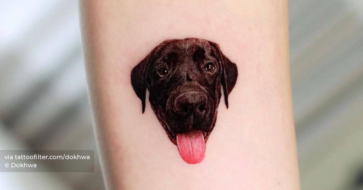 Labrador portrait tattoo located on the inner arm.