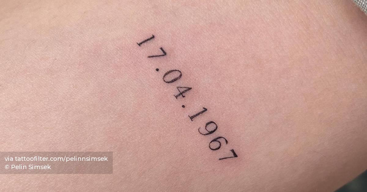 Date tattoo located on the inner arm.
