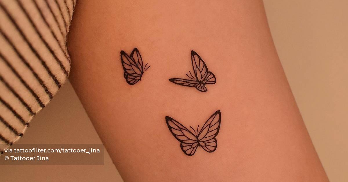 Fine line style butterflies tattoo located on the inner