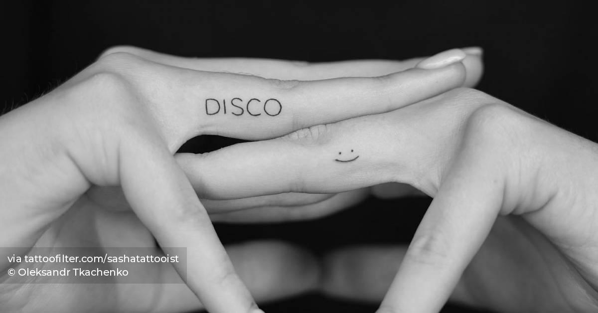 Word "disco" and smiley face tattoos located on the