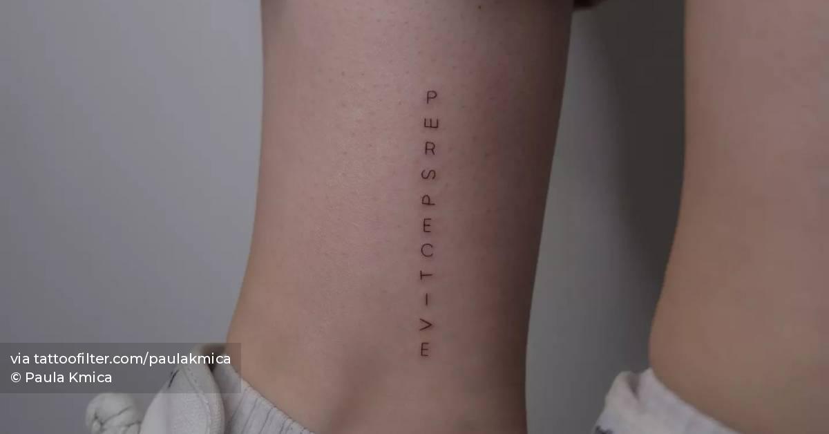 Tattoo of the word "perspective" located on the ankle.