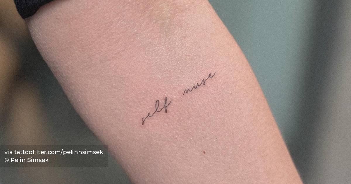 "Self muse" lettering tattoo located on the inner