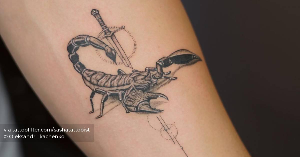 Broken sword and scorpion tattoo done on the inner