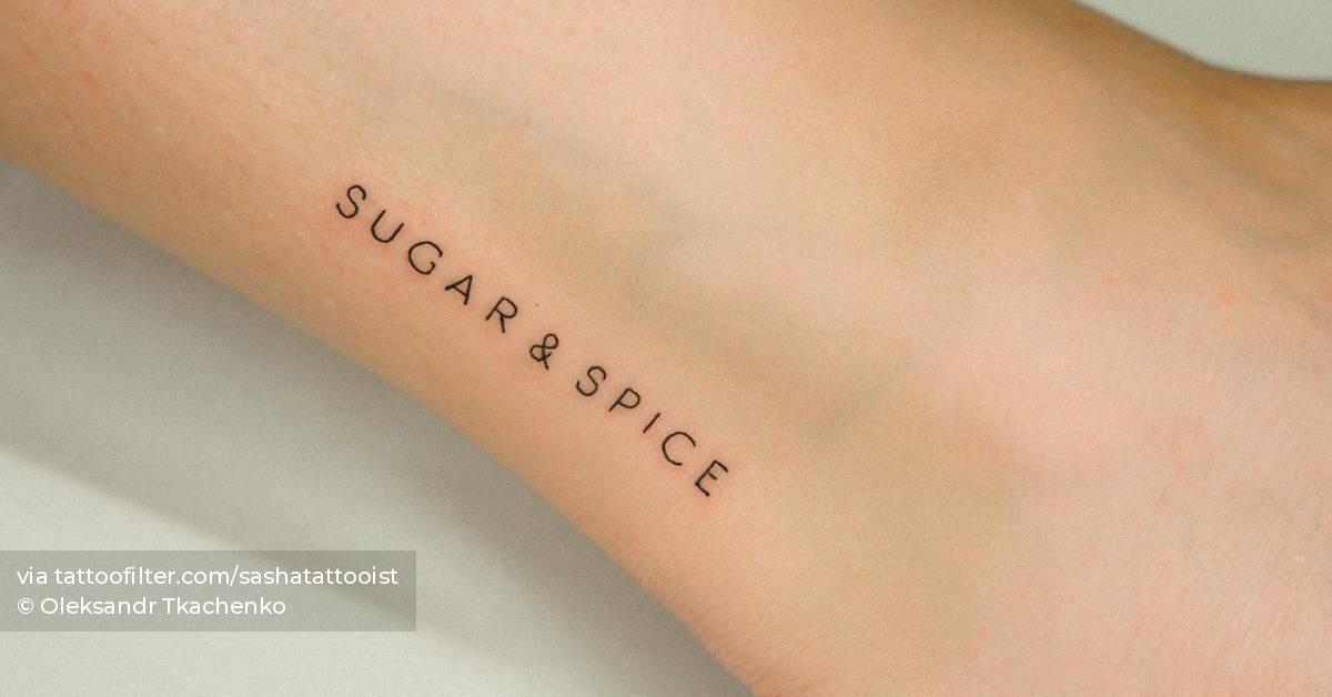 "Sugar & Spice" lettering tattoo located on the ankle.