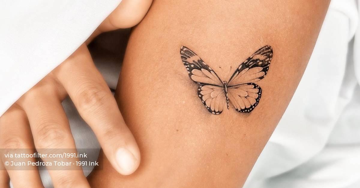 Micro-realistic style butterfly tattoo placed on the