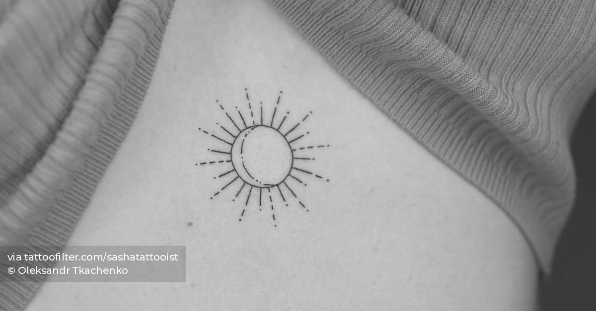 Minimalistic style eclipse tattoo located on the