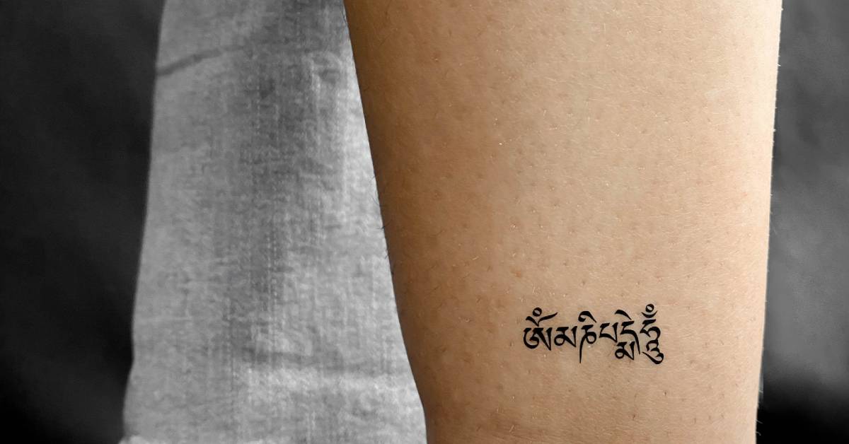 Tibetan "Om Mani Padme Hum" temporary lettering tattoo