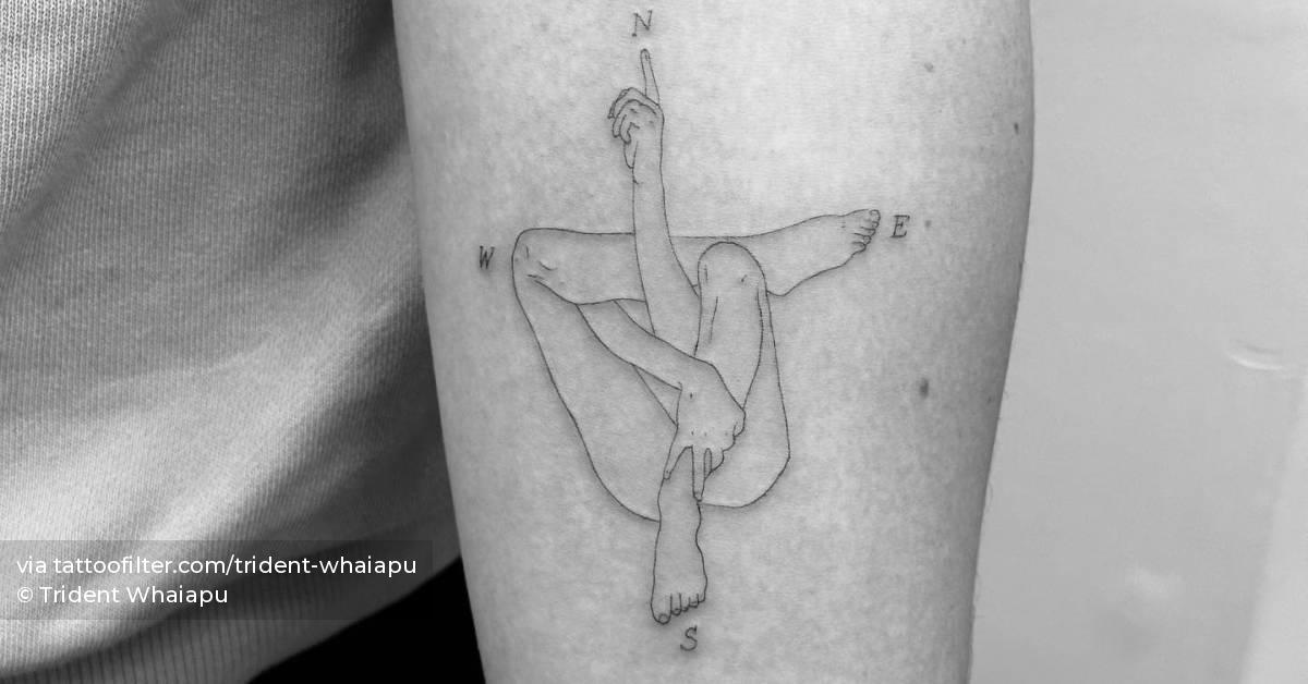 Arms and legs compass rose tattooed on the inner