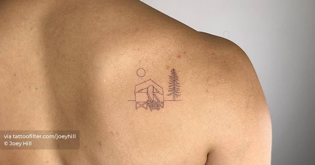Fine line style house tattoo located on the shoulder