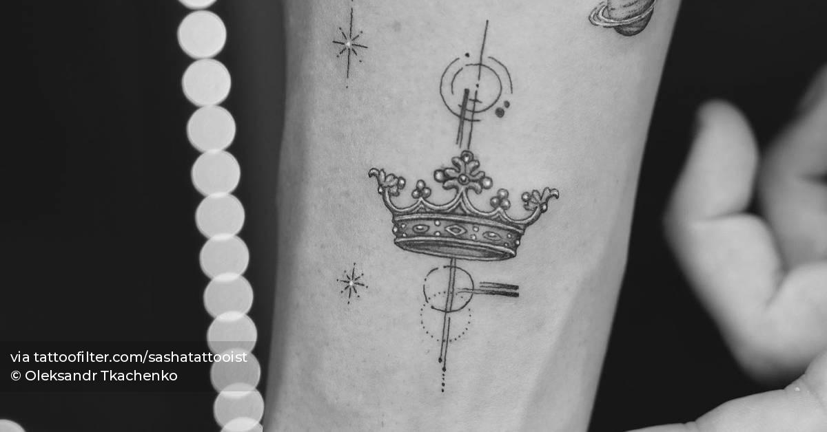 Crown tattoo located on the wrist, illustrative style.
