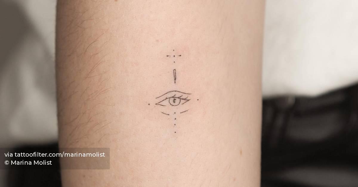 Minimalistic eye tattoo located on the inner forearm.