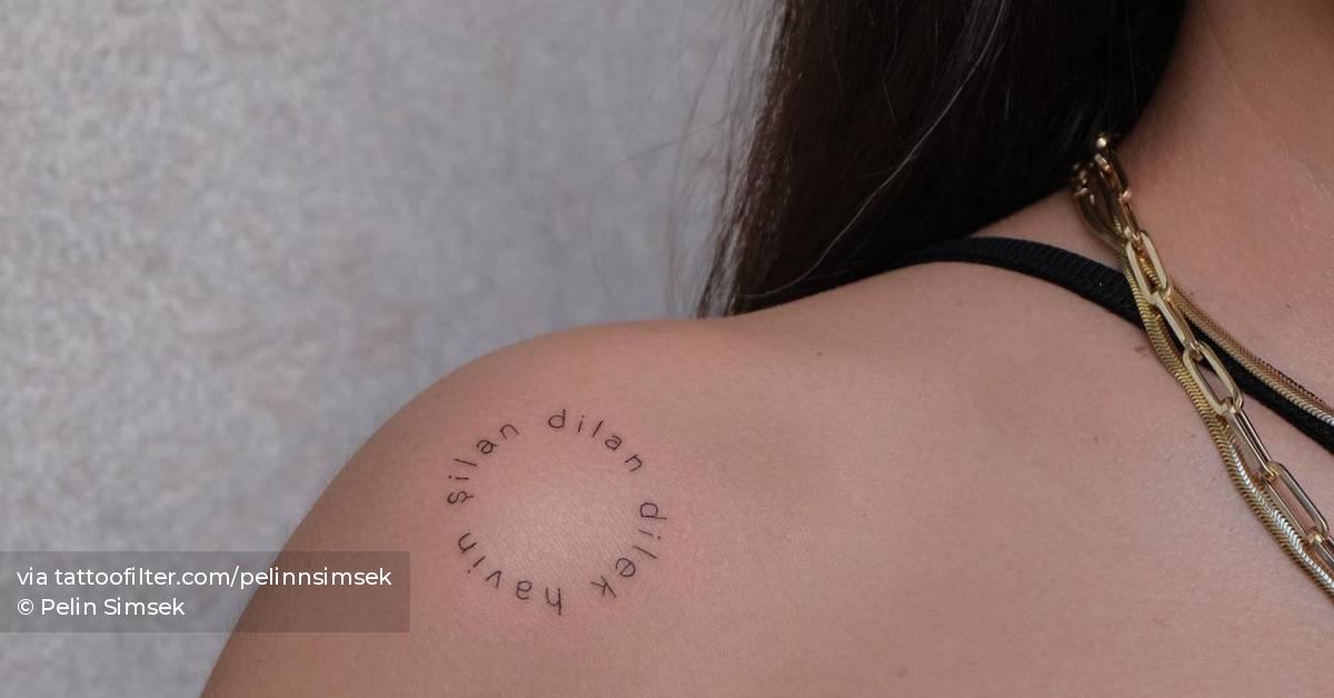 Names forming a circle tattooed on the shoulder.