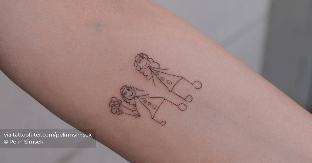 Child's drawing tattoo located on the inner forearm.