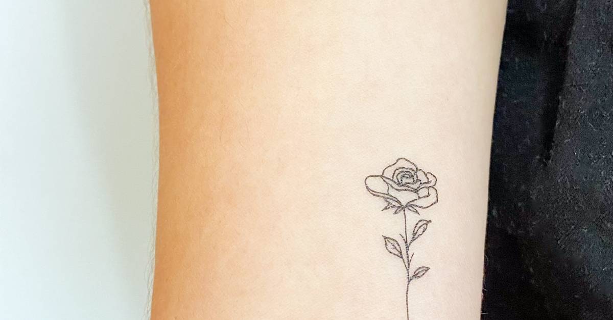 Fine line rose temporary tattoo located on the inner