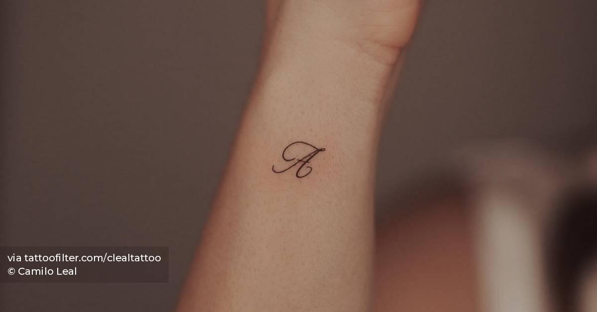 Letter "A" tattoo located on the wrist.
