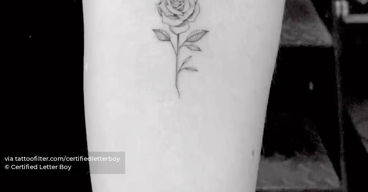 Name "Mabel" and micro-realistic rose tattooed on the