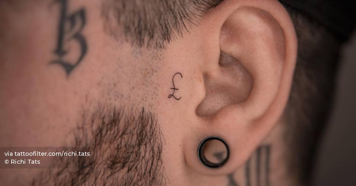 Pound sign tattoo located on the ear, minimalistic