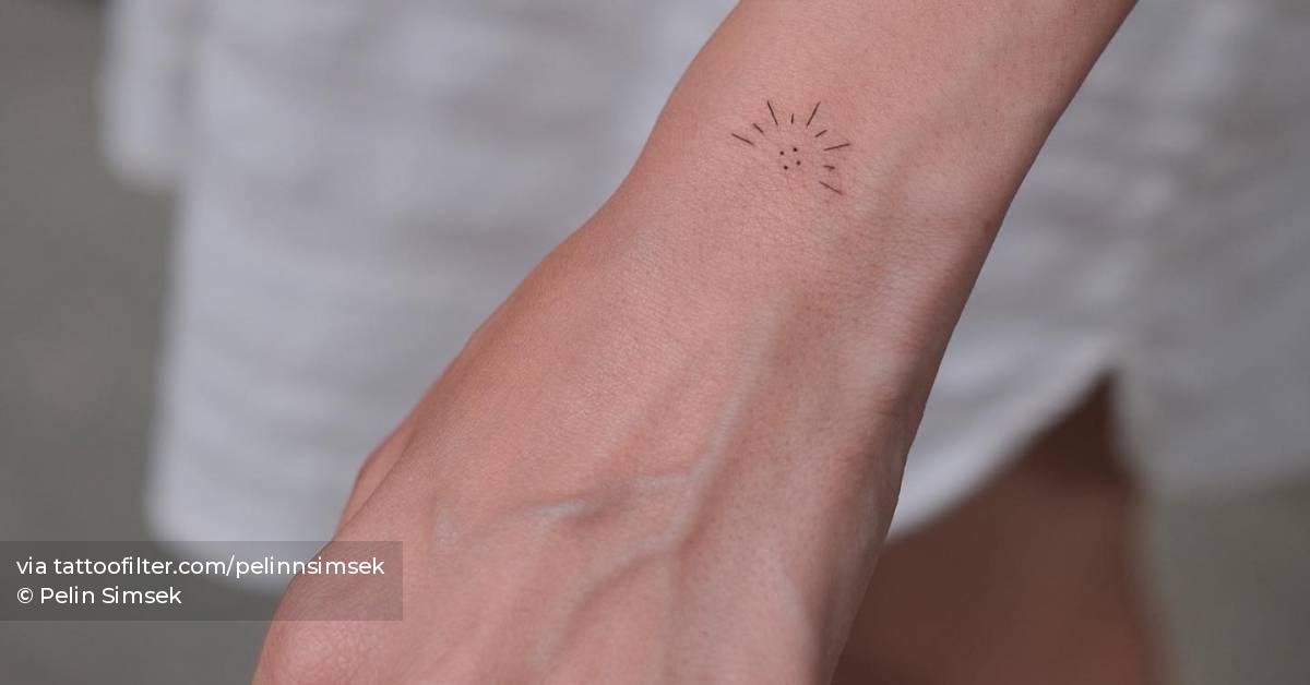 Minimalistic style sunset tattoo done on the wrist.