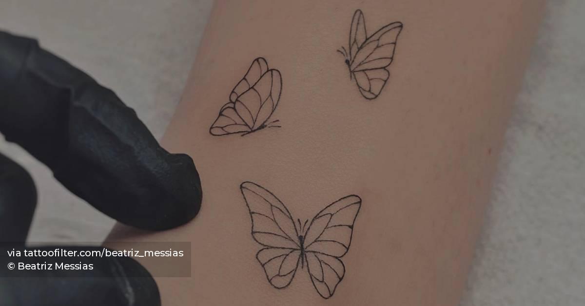 Fine line style butterflies tattoo located on the