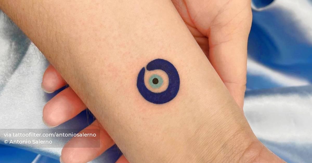Nazar tattoo located on the wrist, illustrative style.