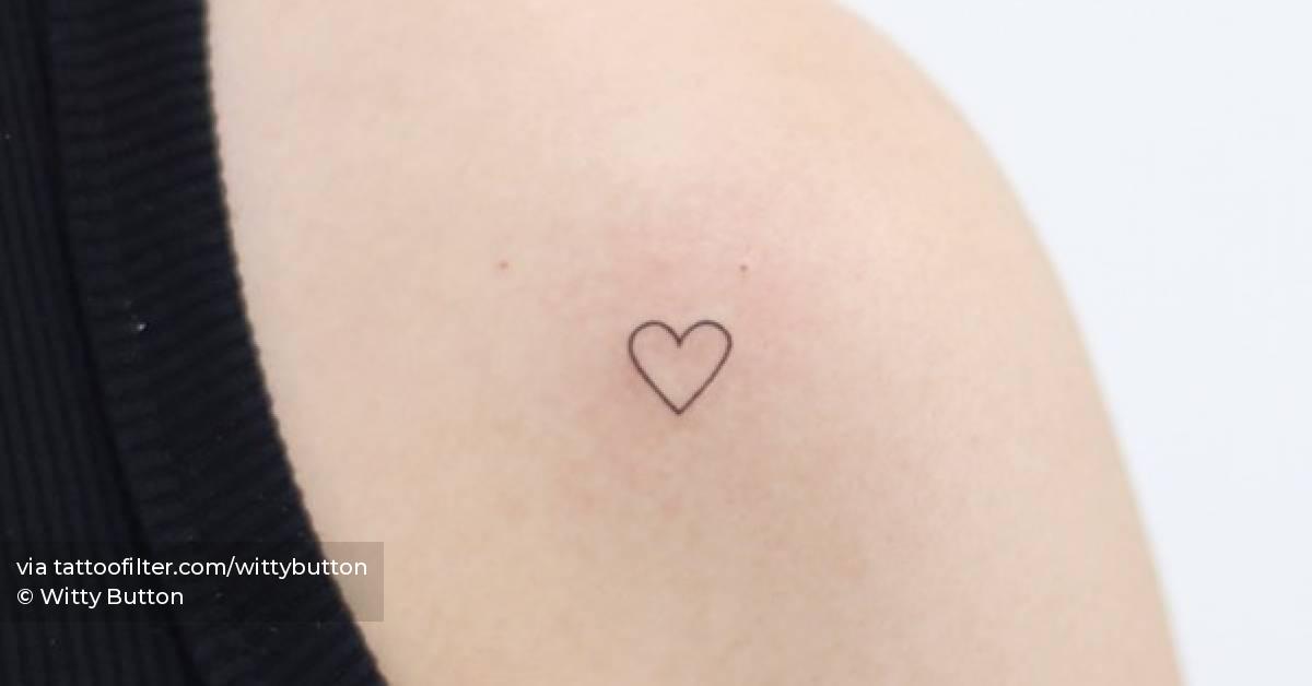 Minimalistic style heart tattoo placed on the shoulder.