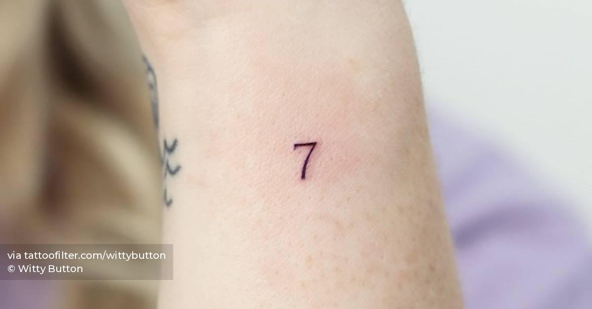 Minimalistic tattoo of the number "7" done on the