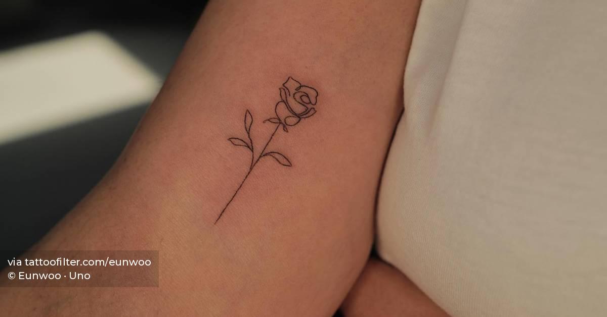 One line rose tattoo placed on the inner arm.