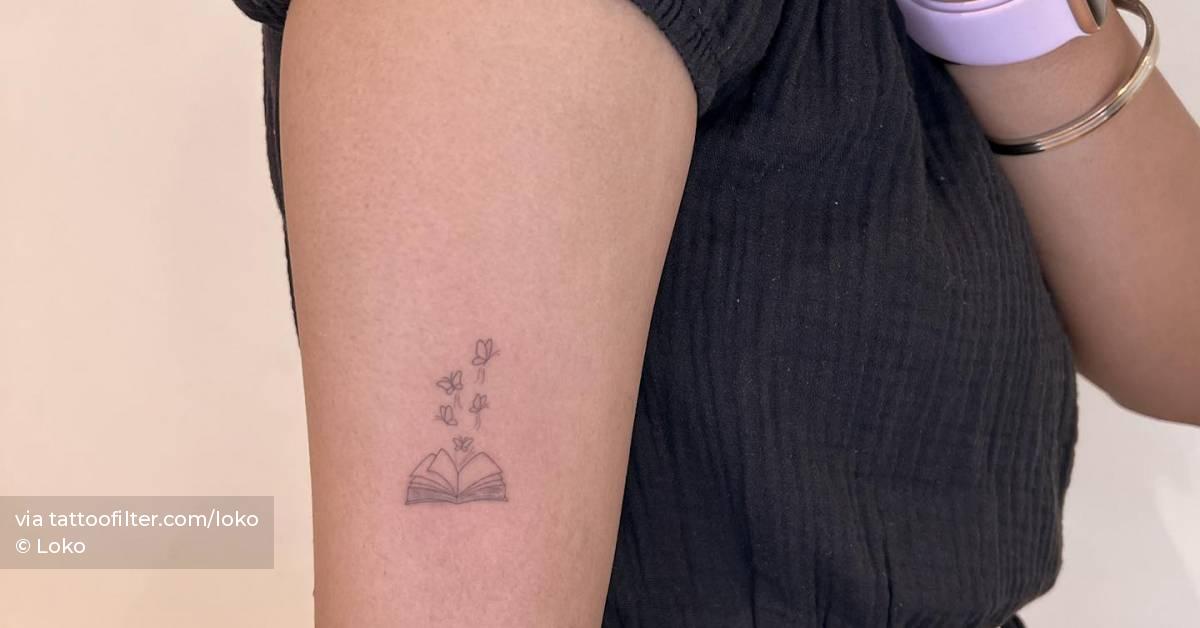 Fine line style book and butterflies tattoo placed on