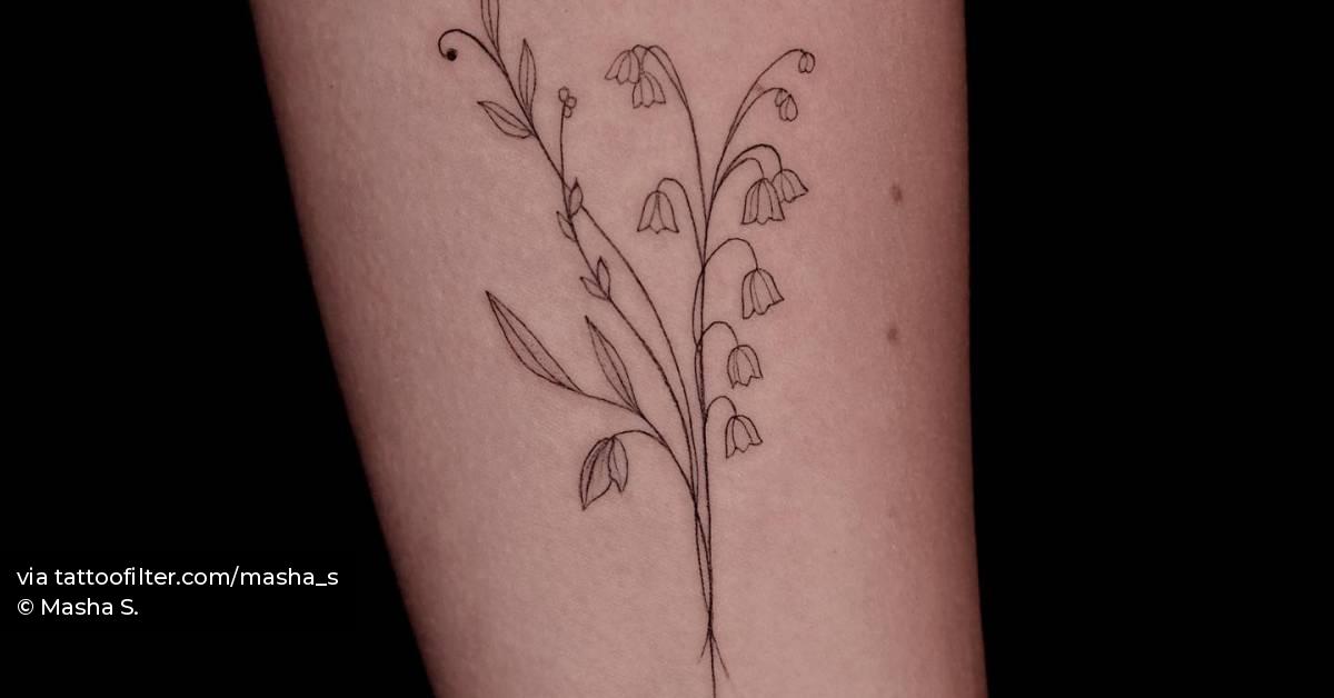 Fine line style lily of the valley tattoo located on