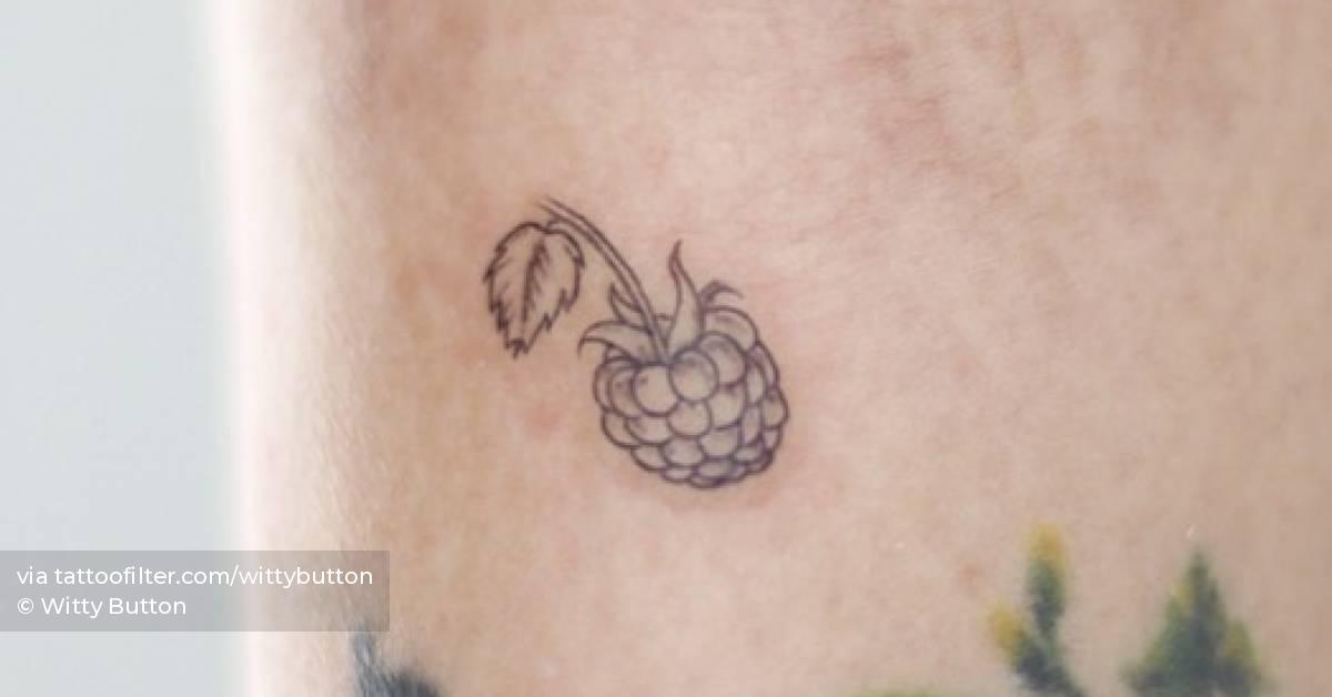 Cute tiny raspberry tattoo located on the inner arm.