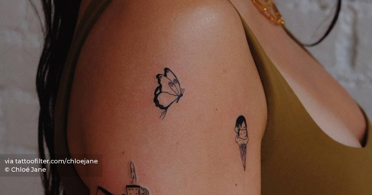 Upper arm composition tattoos, illustrative style.