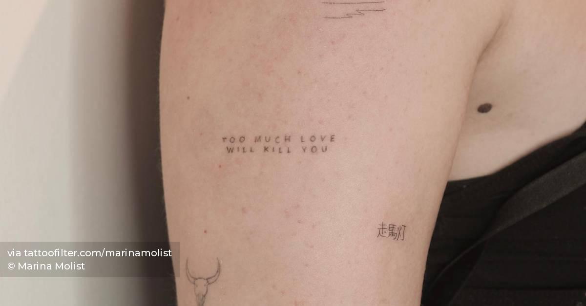 FIne line style upper arm tattoo composition.