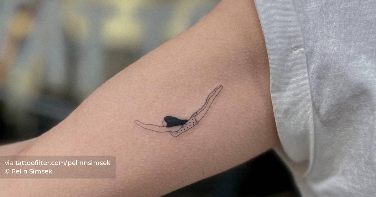 High diving tattoo located on the inner arm.