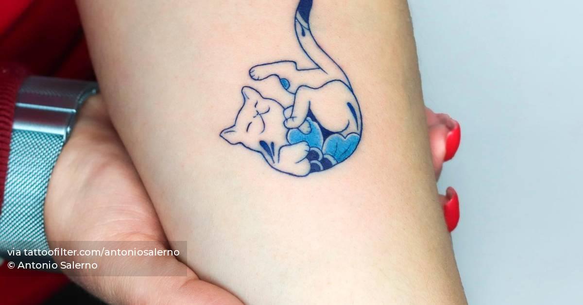 Cute blue porcelain cat tattoo done on the inner