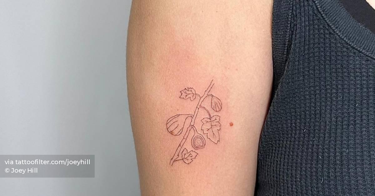 Fig branch tattoo located on the upper arm.