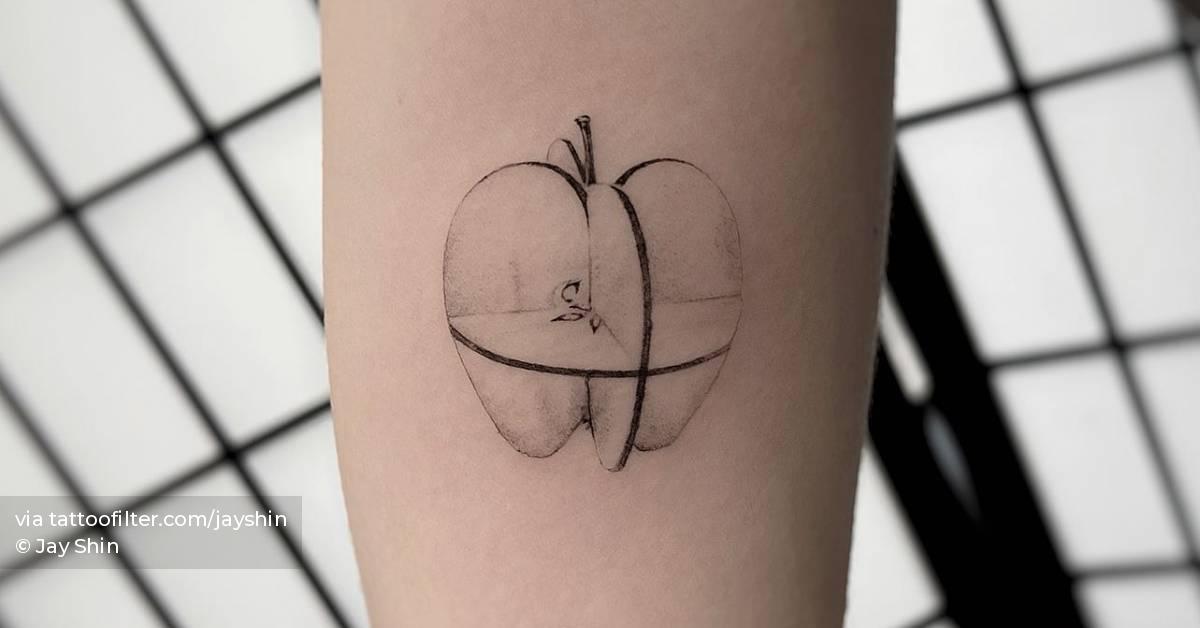 Contemporary apple tattoo done on the inner arm.