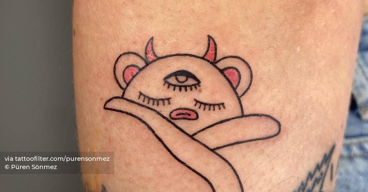 Little demon tattoo located on the forearm,