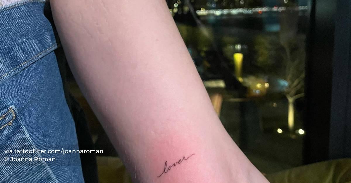Lettering tattoo of the word "lover" handwritten on the