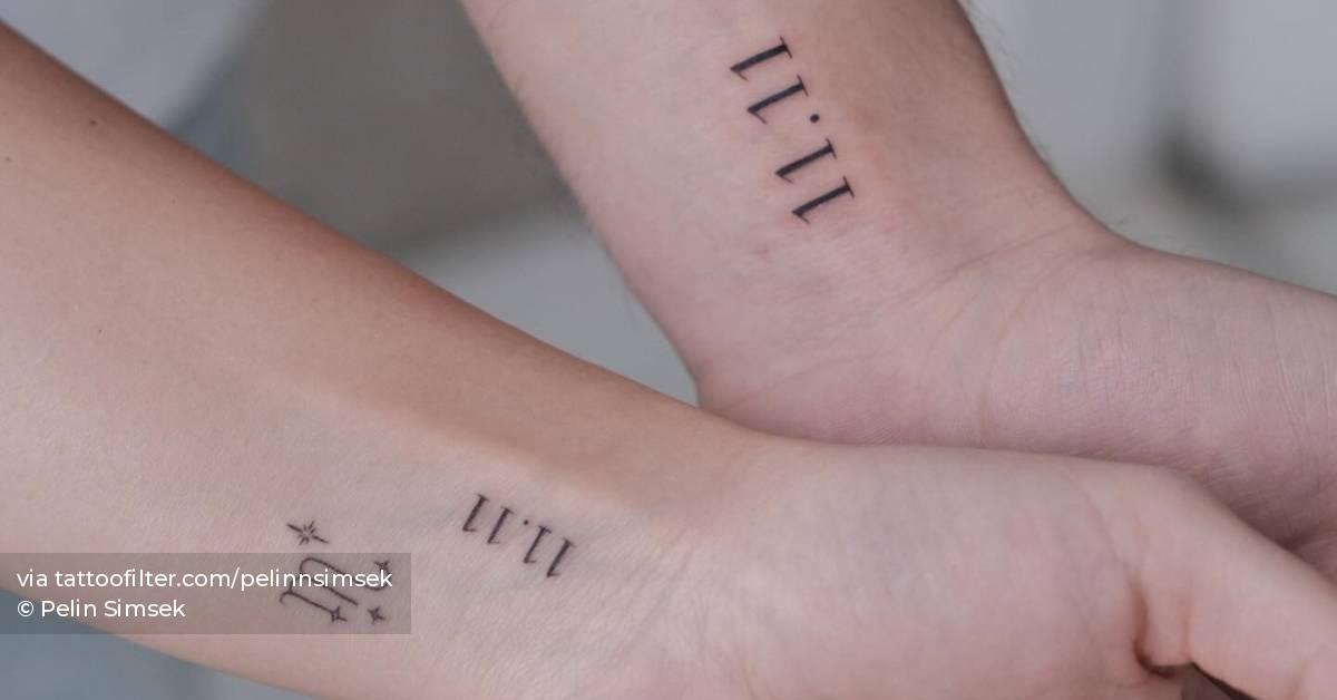 Matching tattoo of the number "11:11" for couple.
