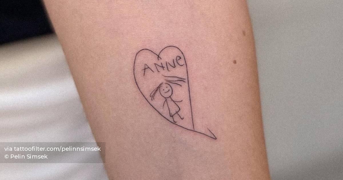 Child's drawing tattoo located on the inner forearm,