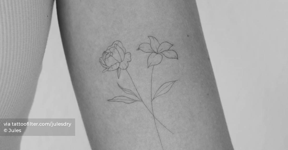Fine line style peony and lily flower tattoo located on