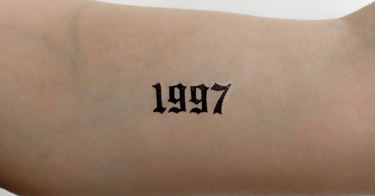 Gothic "1997" birth year temporary tattoo located on
