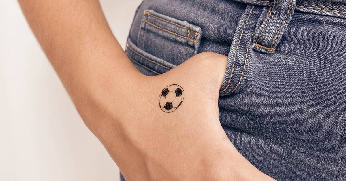 Football ball temporary tattoo located on the ham,
